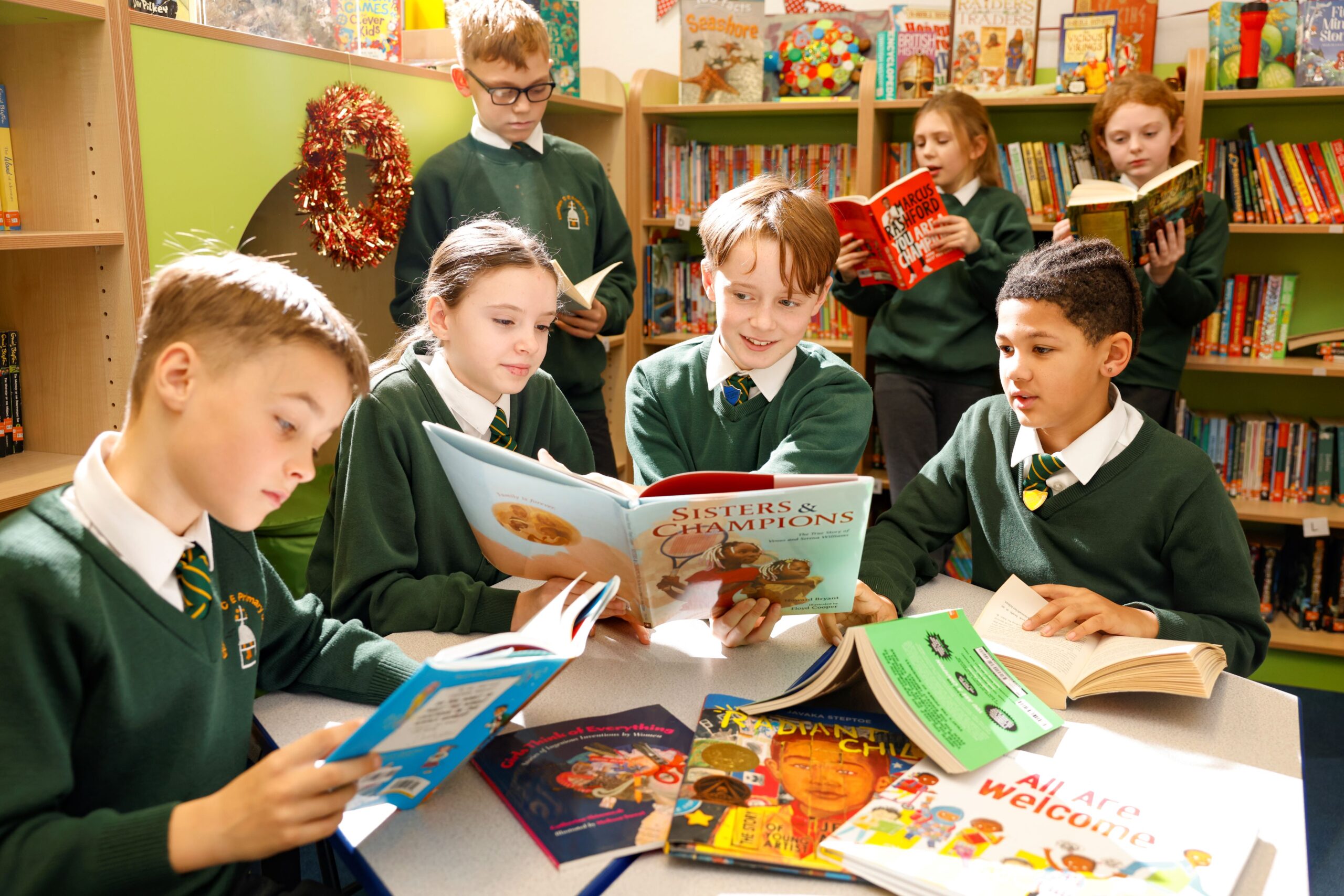 Dandara gifts £350 to purchase new books for local school - The Daily Brit
